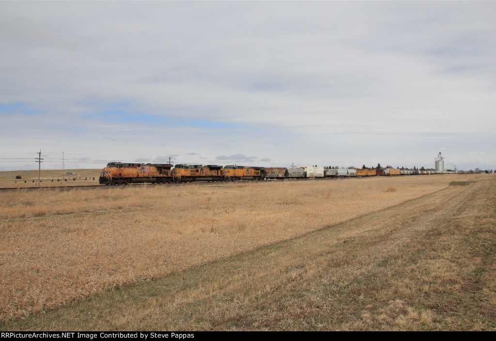 UP 5452 takes a train across the Nebraska plains